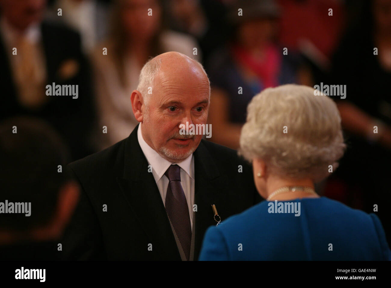Mr. Thomas Harper from Bath is made an MBE by The Queen at Buckingham ...