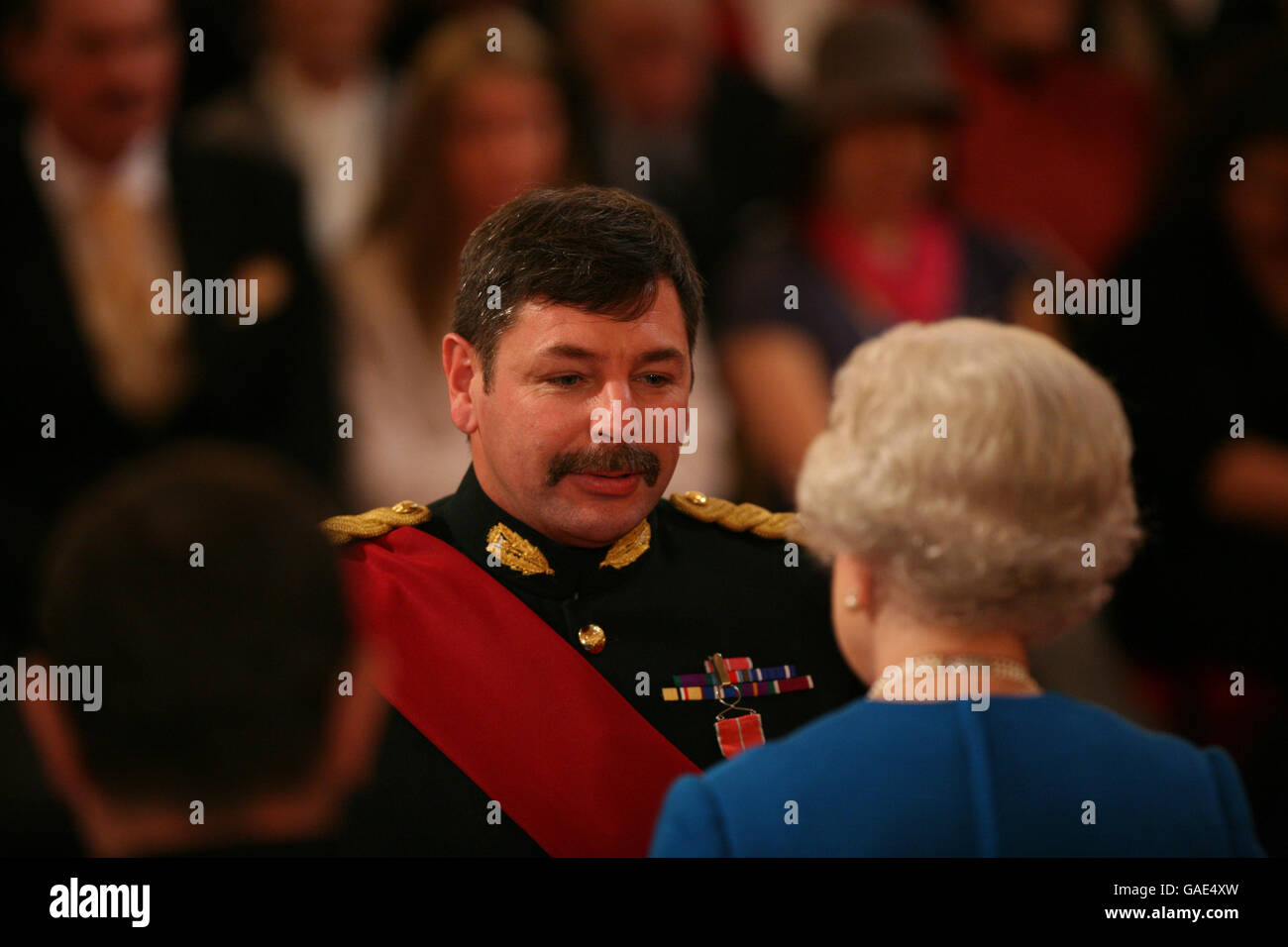Major Gary McGown is made an MBE by The Queen at Buckingham Palace ...