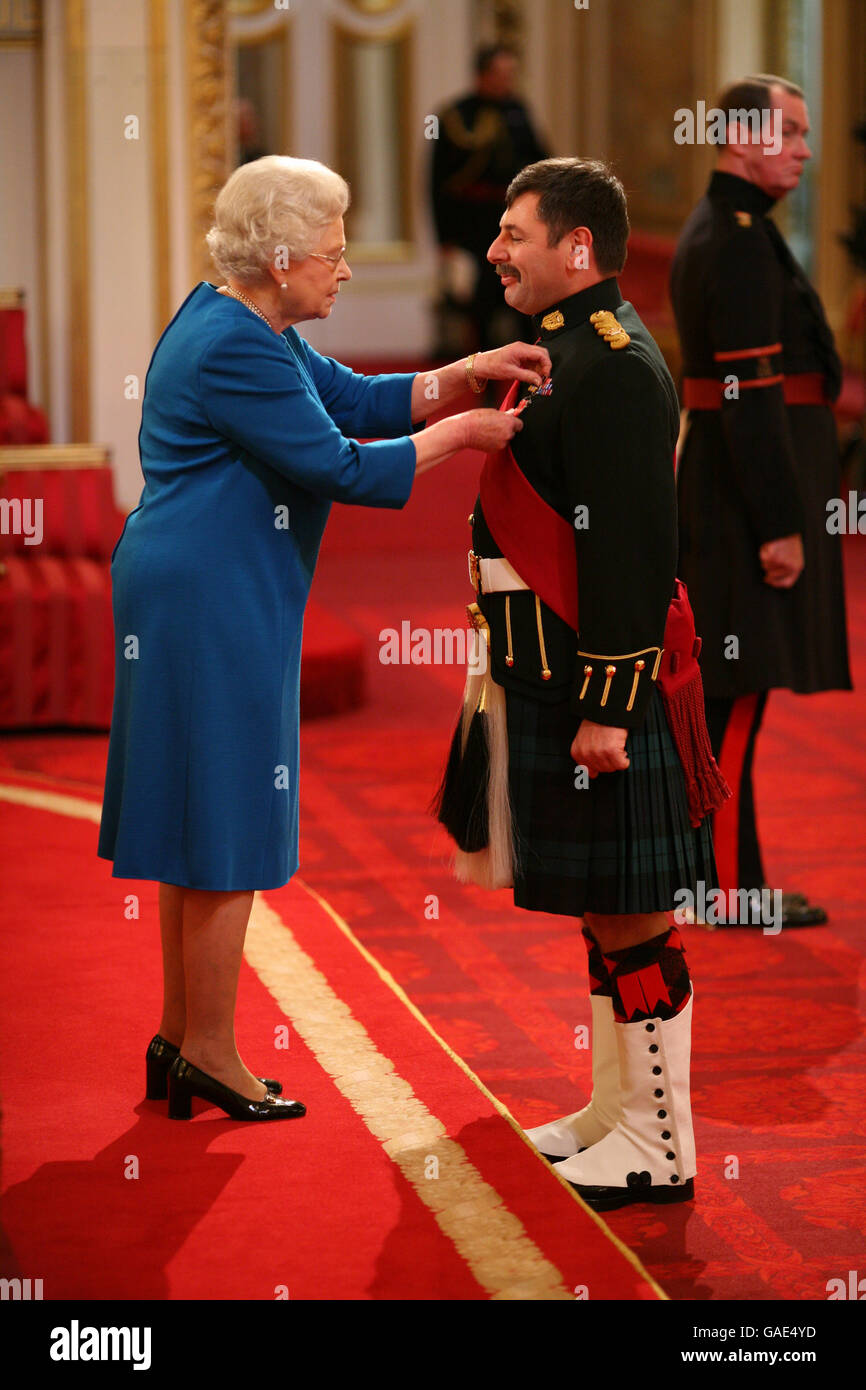 Major Gary McGown is made an MBE by The Queen at Buckingham Palace ...
