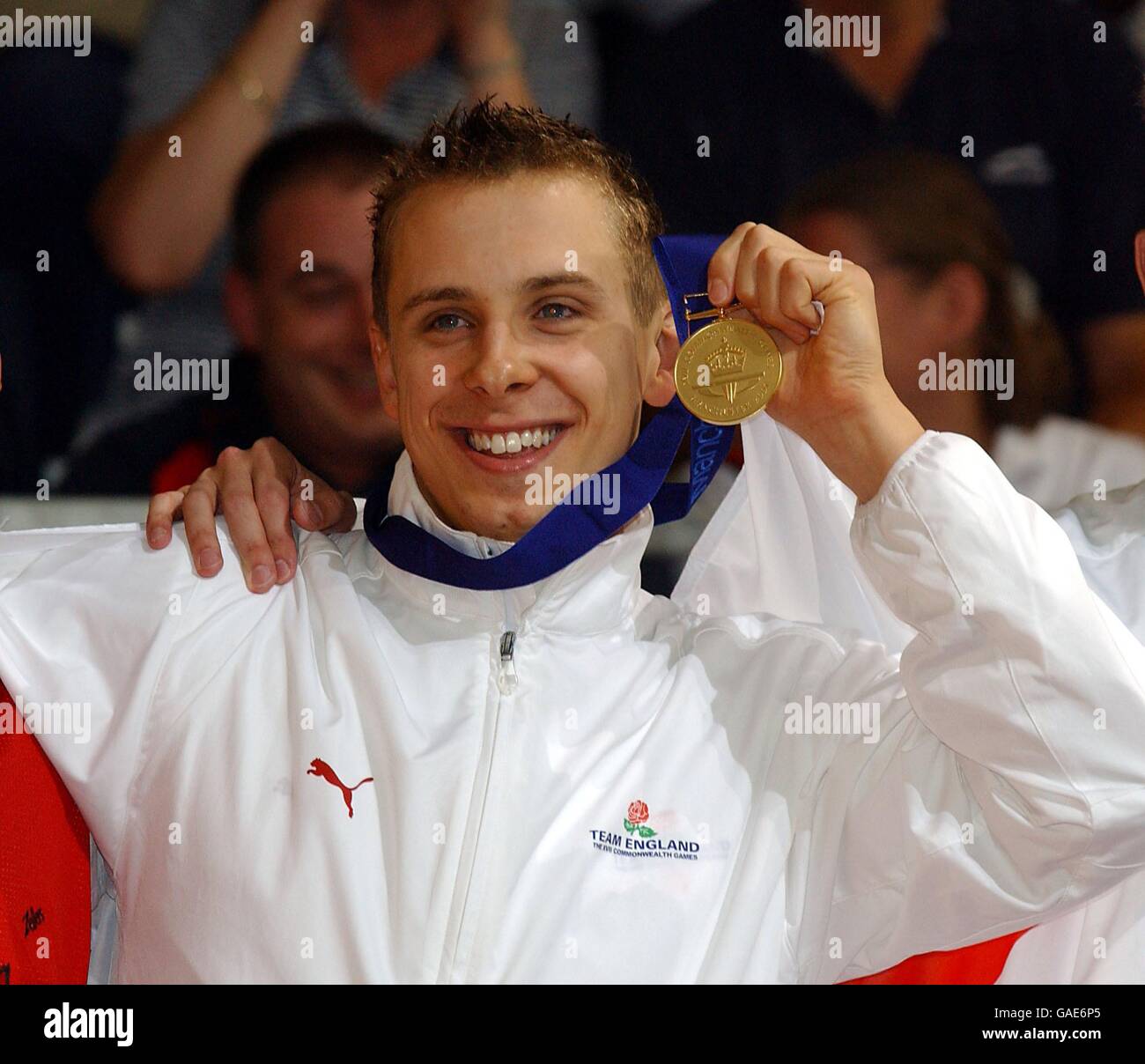 Englands adam whitehead shows off his 100m breaststroke gold medal hi ...