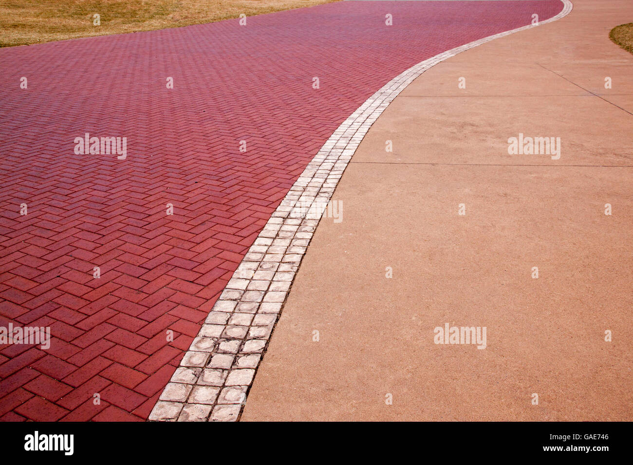Above view of concrete and red paved patterns and textures on promenade ...