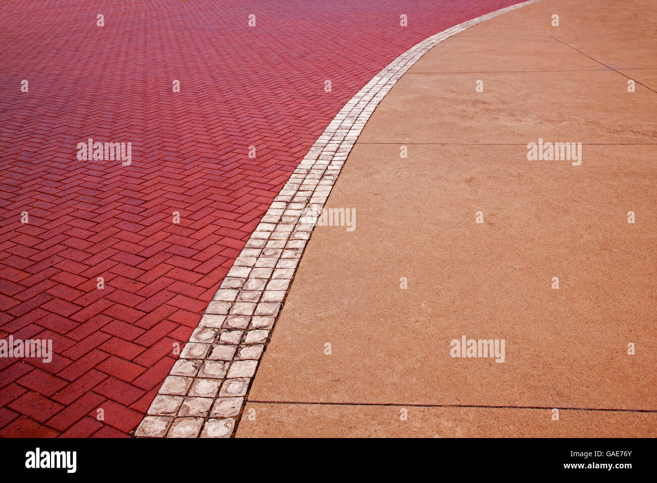 Close up view of concrete and red paved patterns and textures on ...