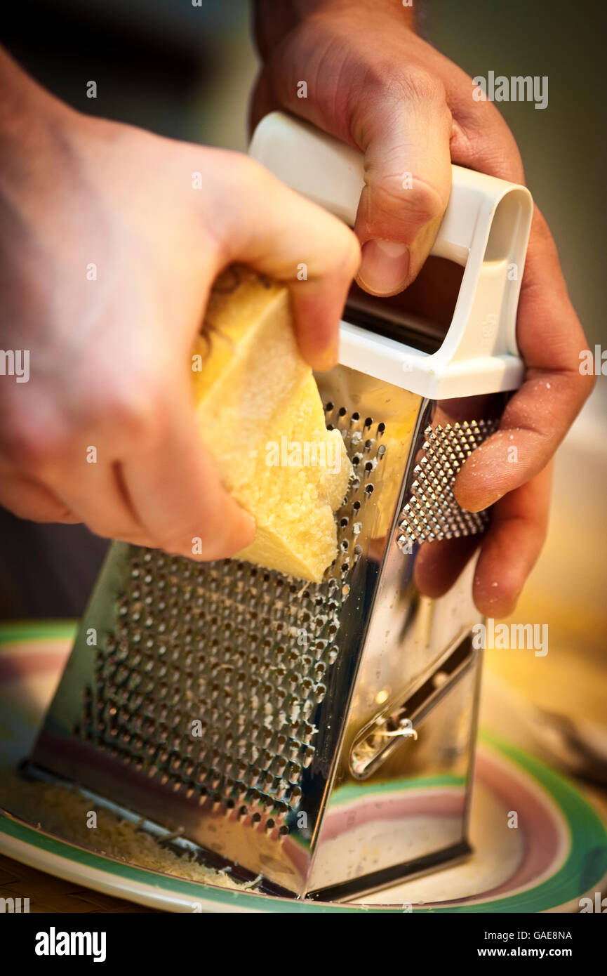Grating parmesan hi-res stock photography and images - Alamy