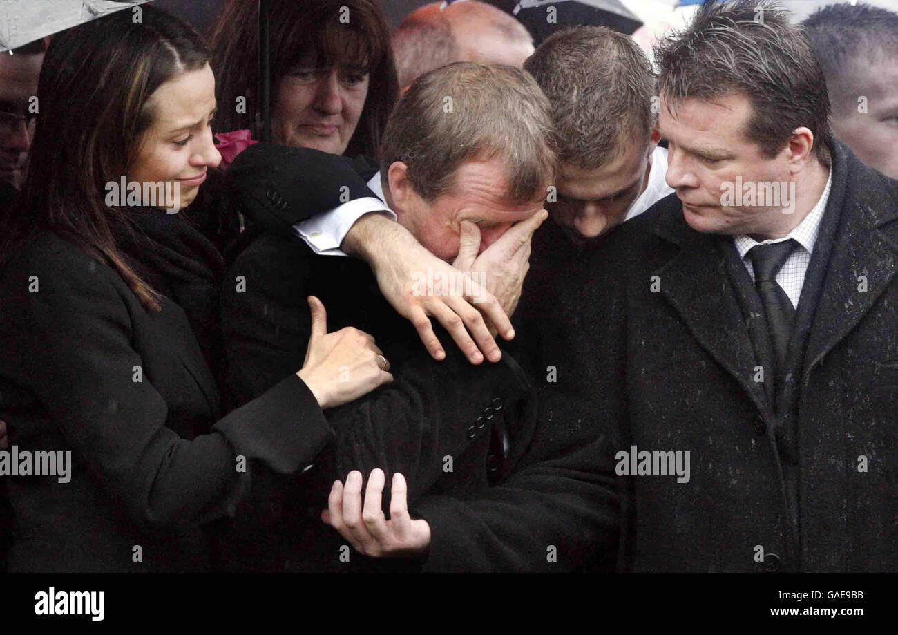 Father Michael Hamilton and half sister Nicole (left) at the burial of ...
