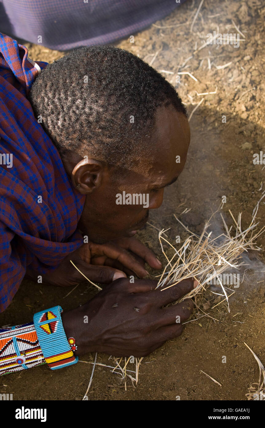 Masai man making fire, Amboseli National Park, Kenya, Africa Stock ...