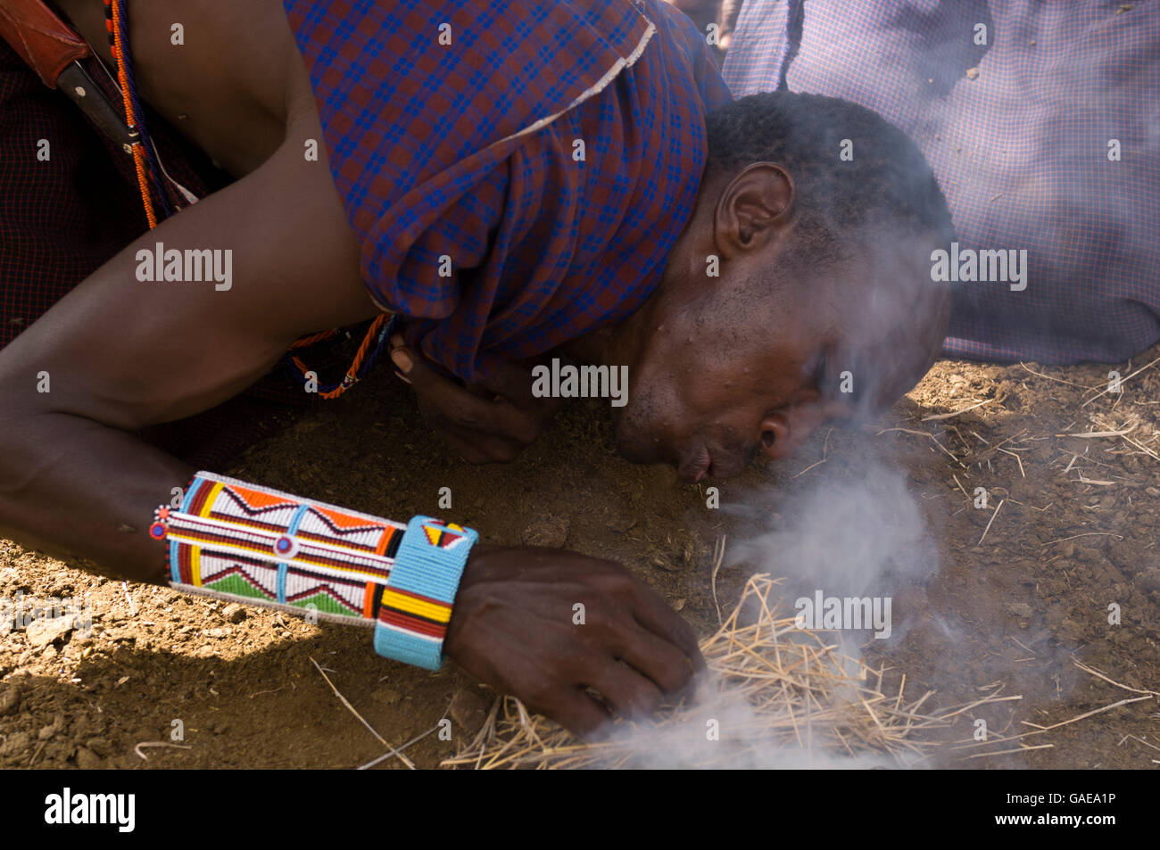 Masai man making fire, Amboseli National Park, Kenya, Africa Stock ...