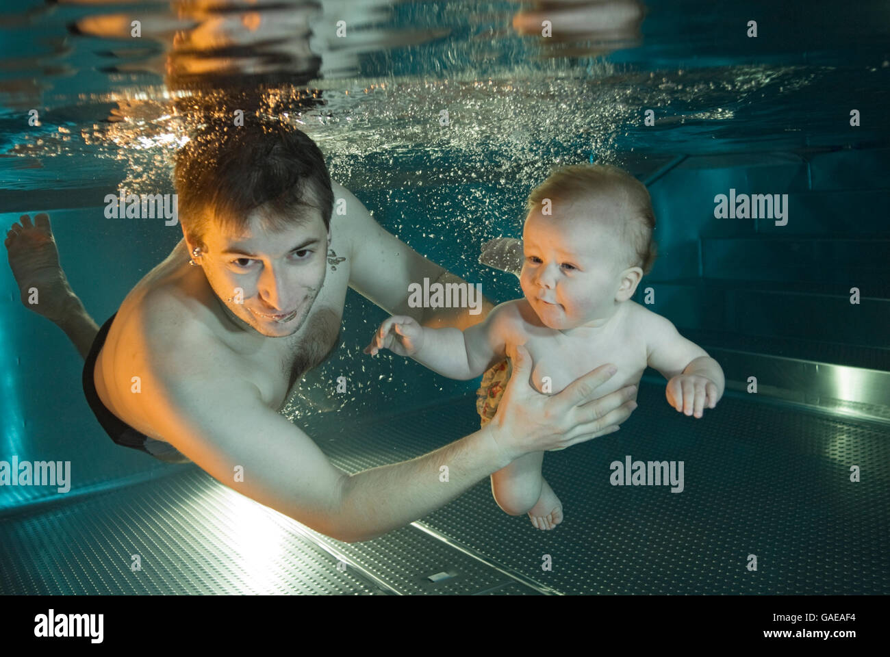 Father and son at swimming pool hi-res stock photography and images - Alamy