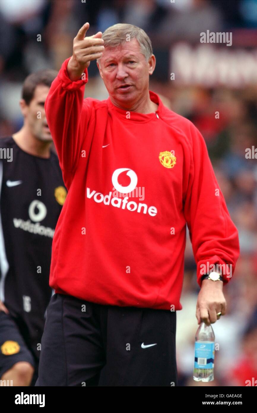 Manchester united manager alex ferguson directs the training session hi ...