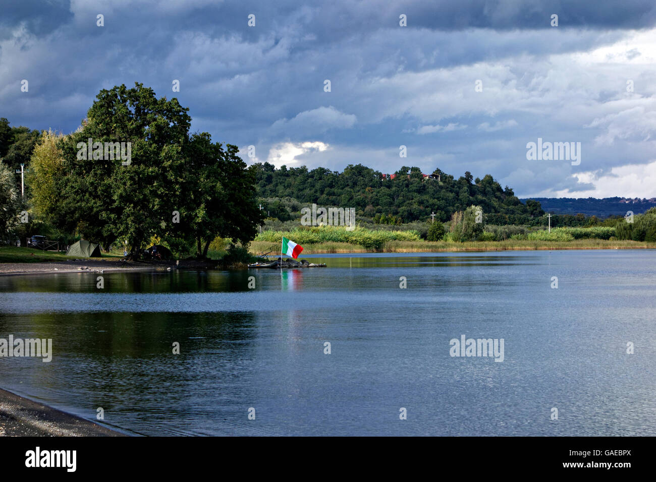 Italian flag flying on Lake Bolsena, Latium, Province of Viterbo, Italy ...