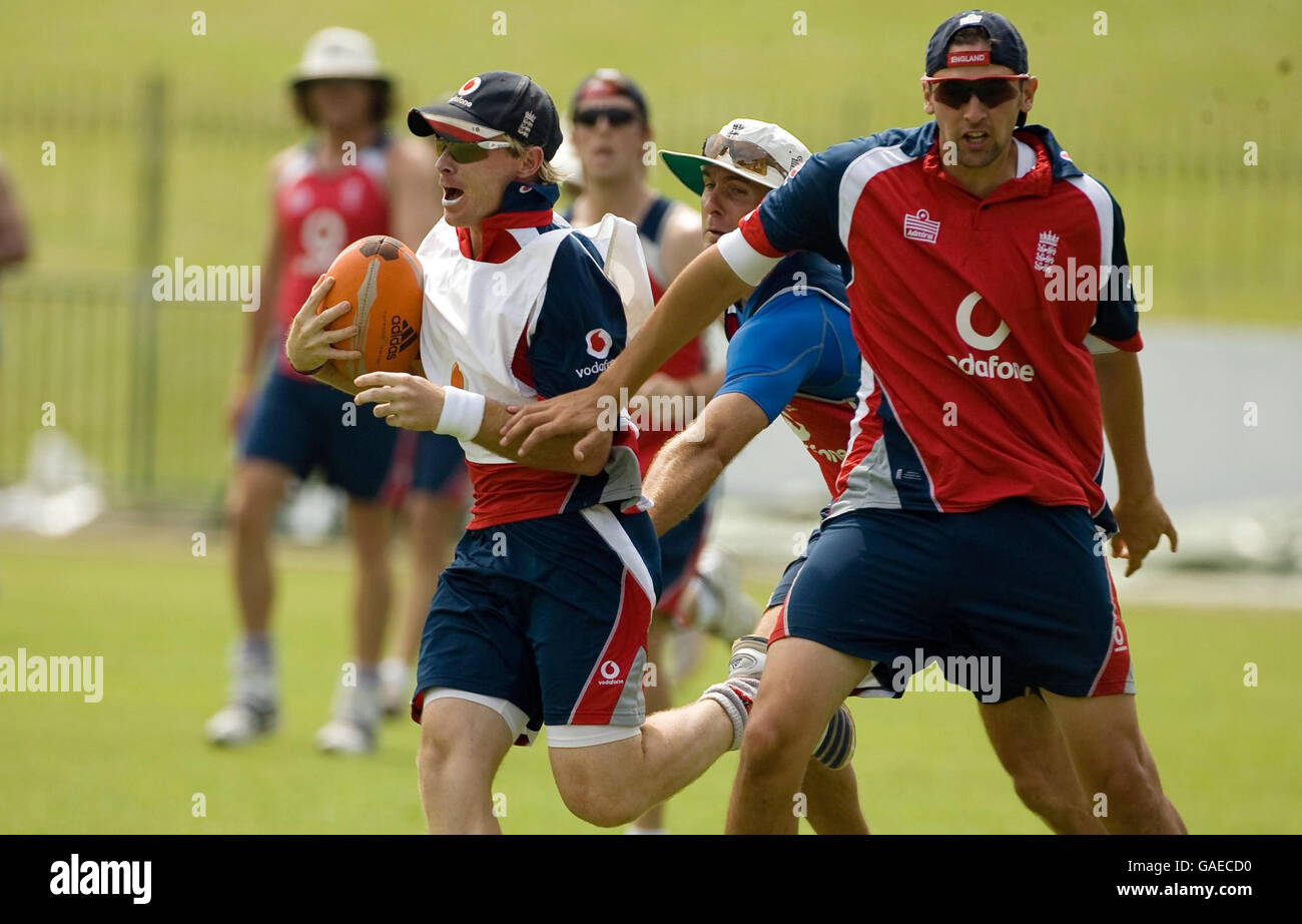 England's Ian Bell gets past captain Michael Vaughan and Steve Harmison ...