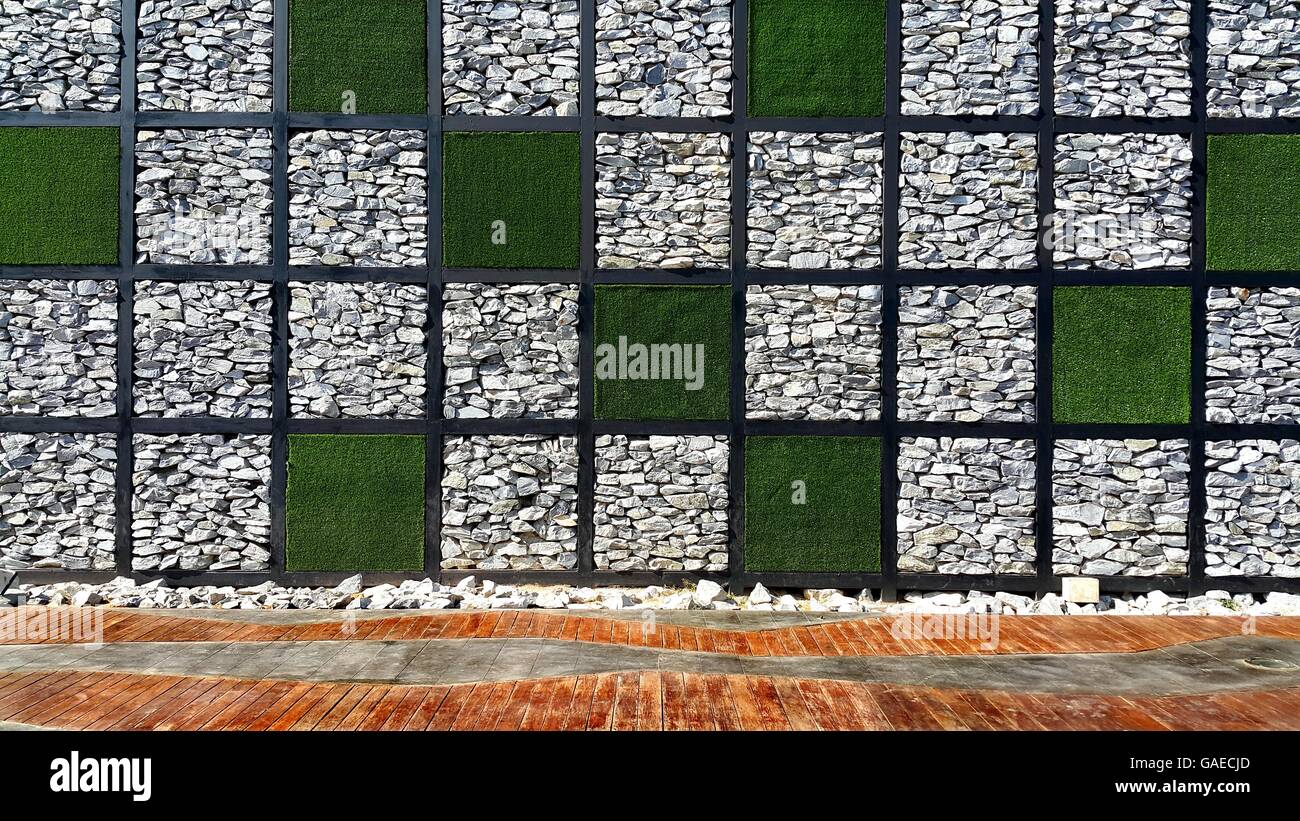 Square check pattern of grass and stone wall with wooden floor Stock ...