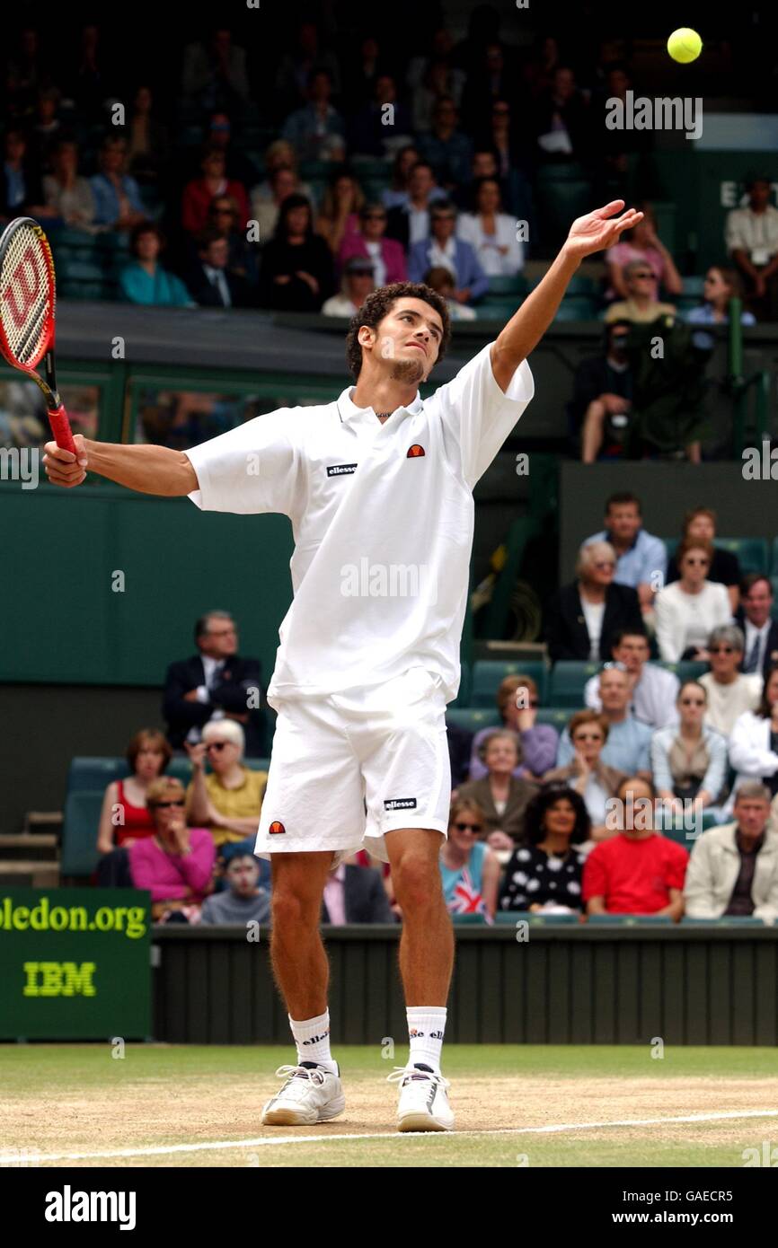Andre sa serves during his loss to tim henman hi-res stock photography ...