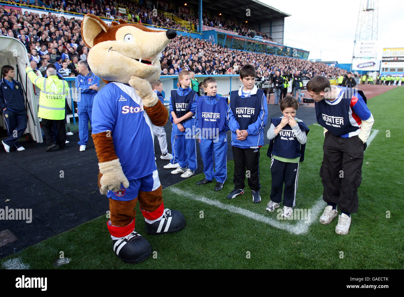 The game mascots line up pre-match with the official club mascot Olga ...
