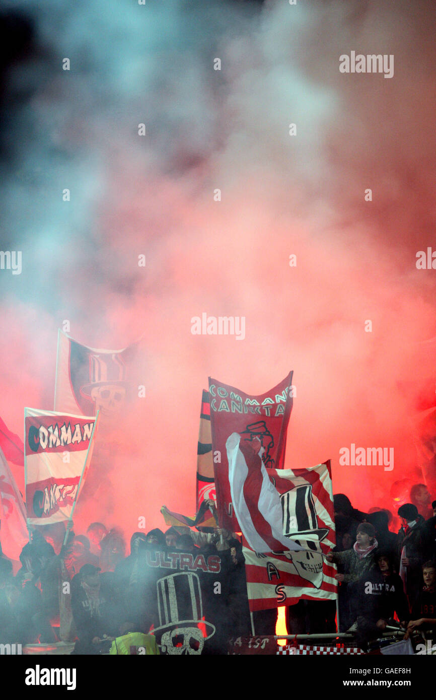 Vfb stuttgart fans stoke up the atmosphere in the stands hi-res stock ...