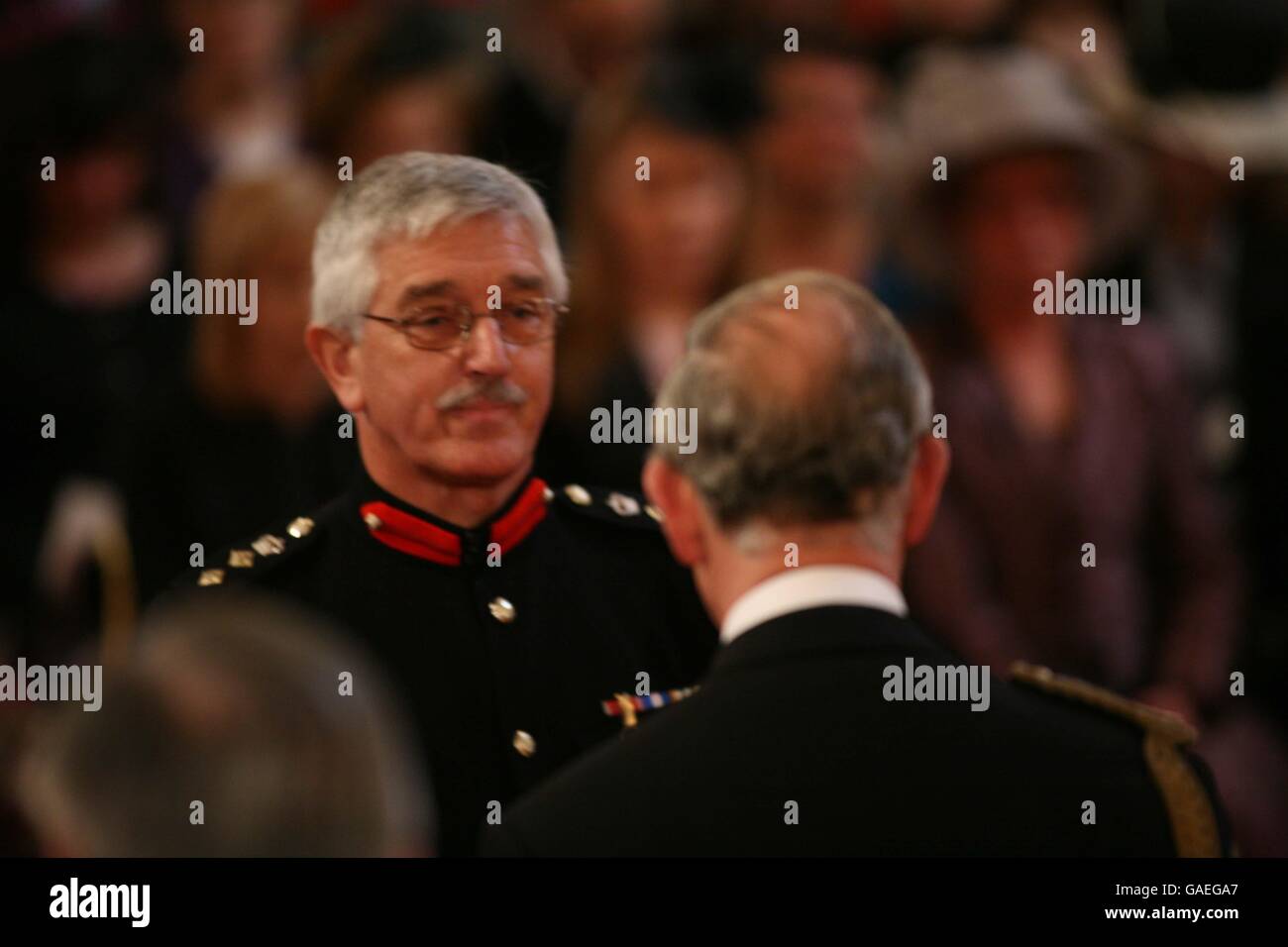 Colonel John Wilson is made an OBE by The Prince of Wales at Buckingham ...