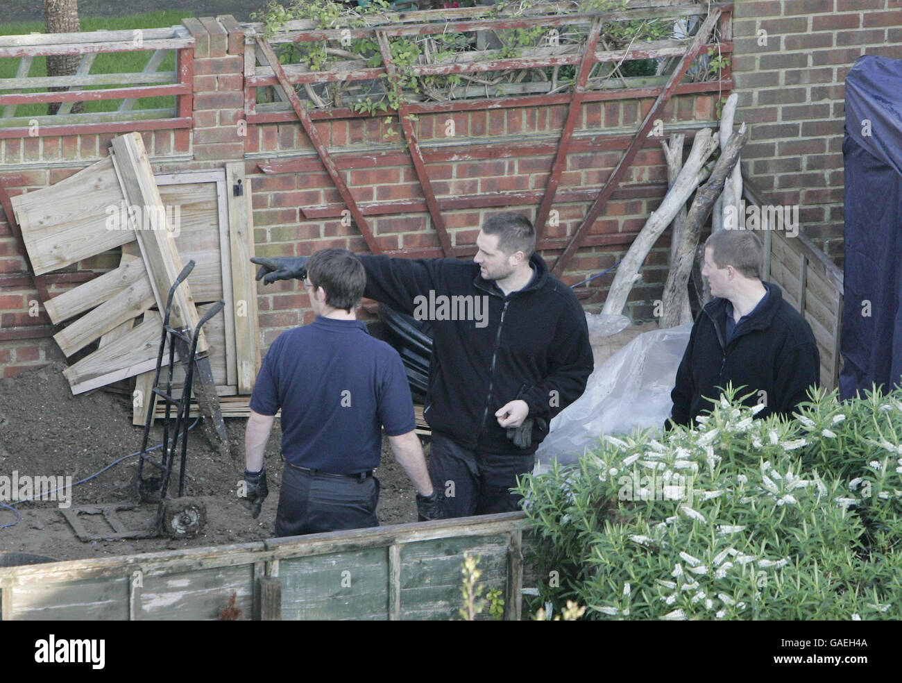 Dig goes on at house after body discovery Stock Photo - Alamy