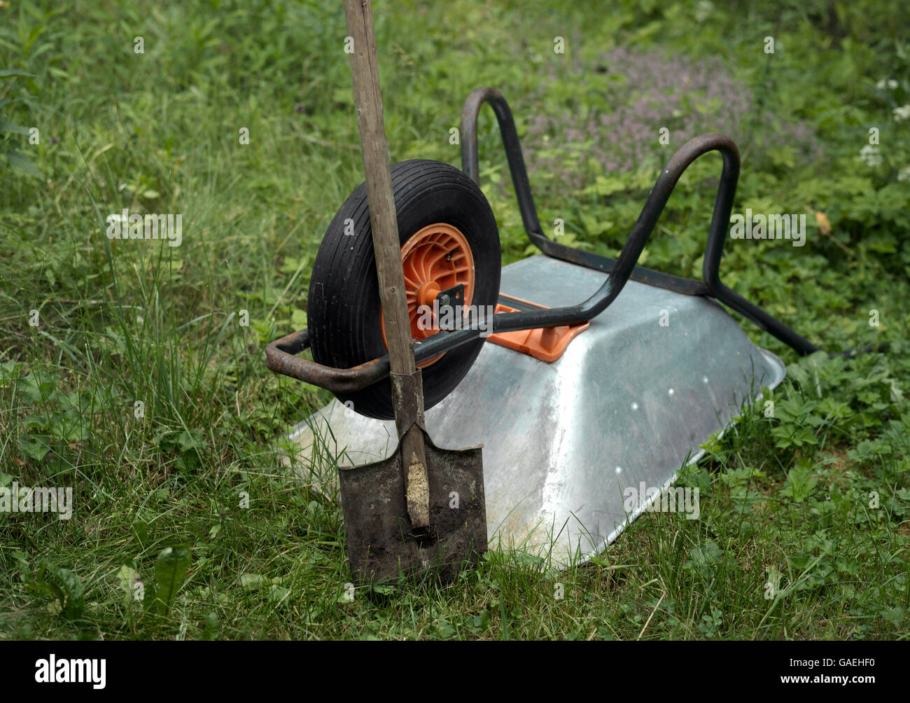 Garden trolley tipped over Stock Photo - Alamy