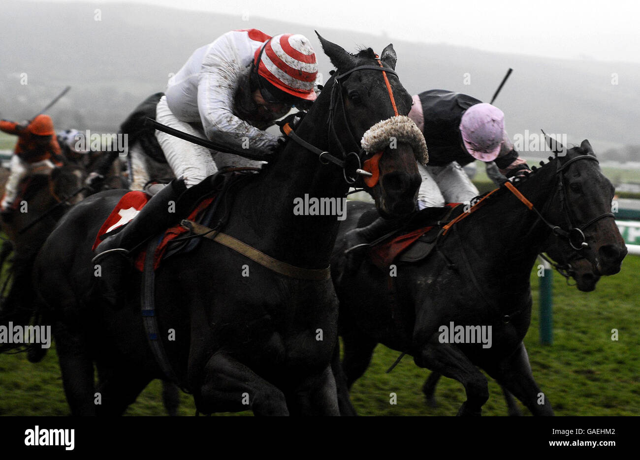 Mendo ridden by Tom Siddall (left) stride out on the run-in to win The ...