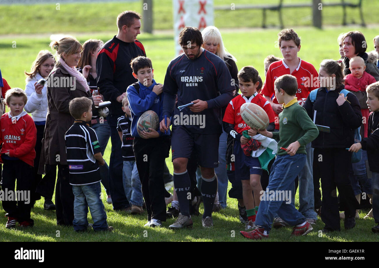 Wales' centre Gavin Henson leads the autograph hunters around Tenby ...