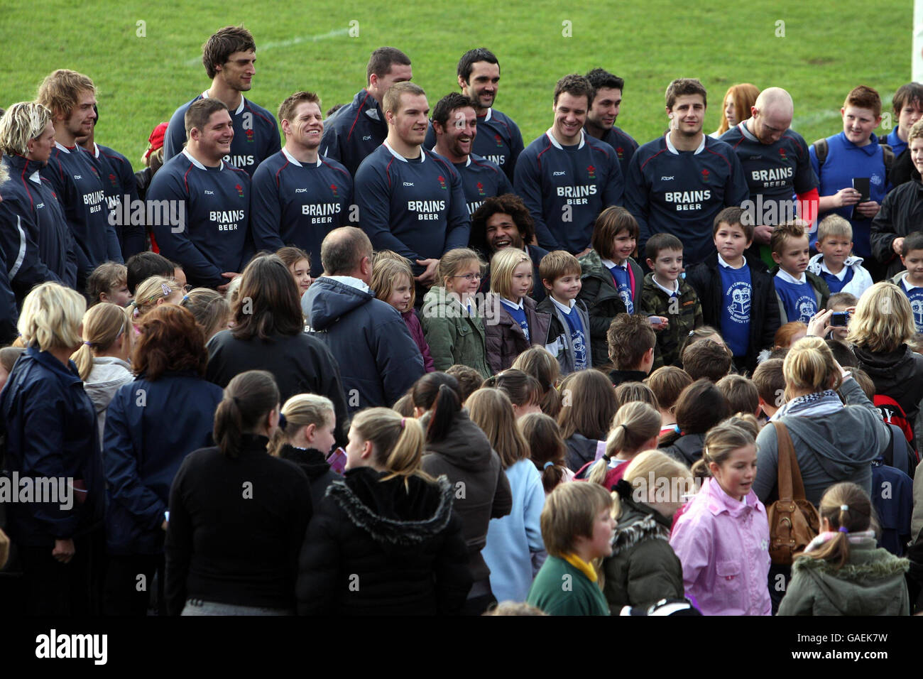 Local school children line up to be photographed with their Wales team ...