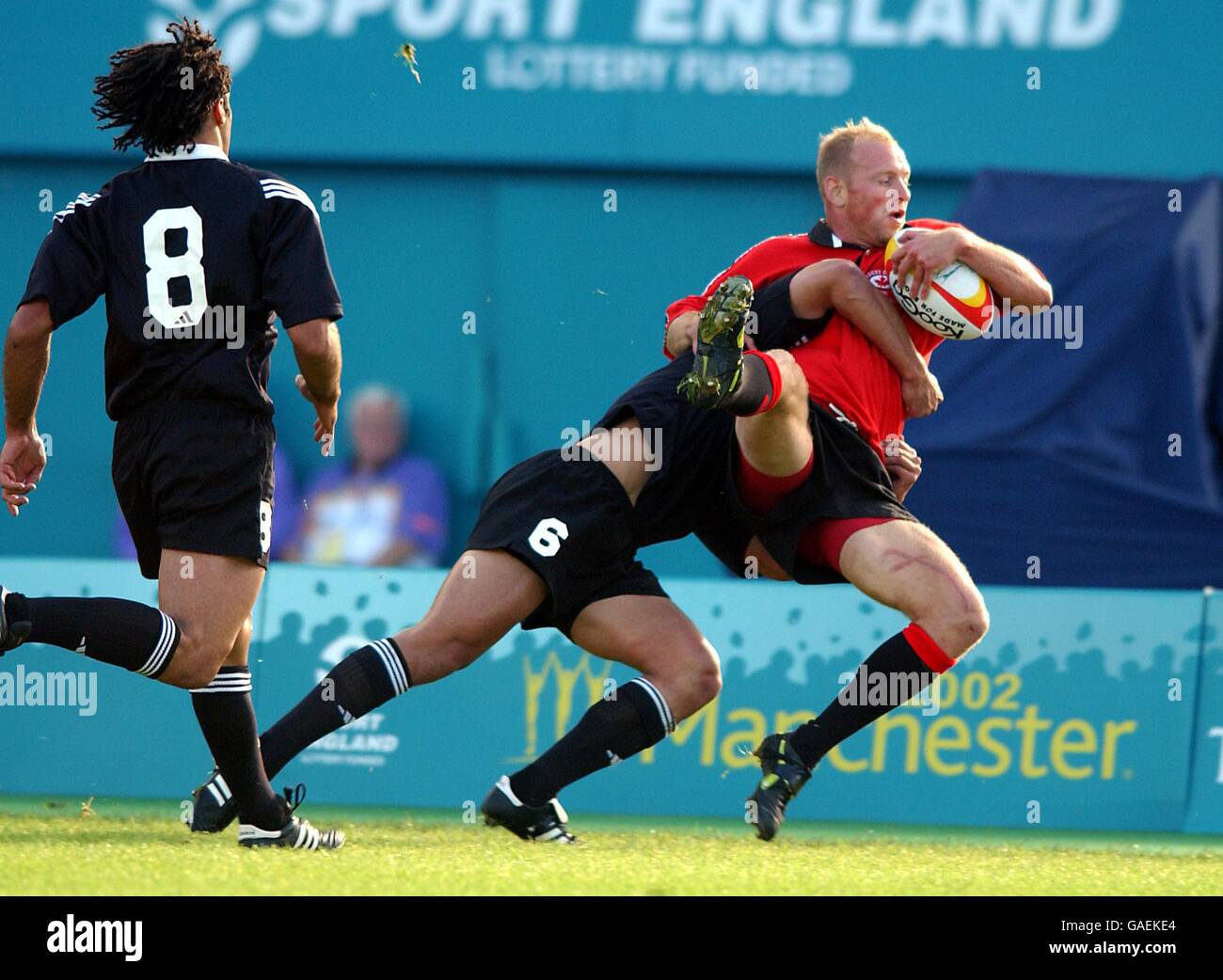 New Zealand's Mils Muliana tackles Canada's Winston Stanley Stock Photo ...