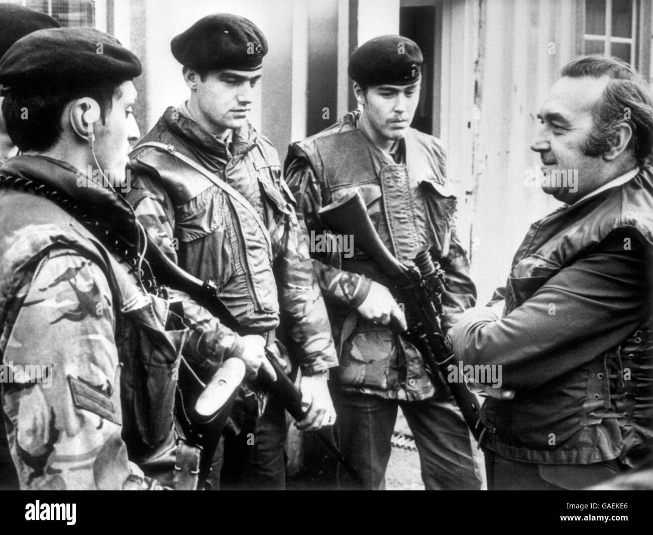 Defence Secretary Mr Roy Mason protected by a bullet-proof jacket and a ...