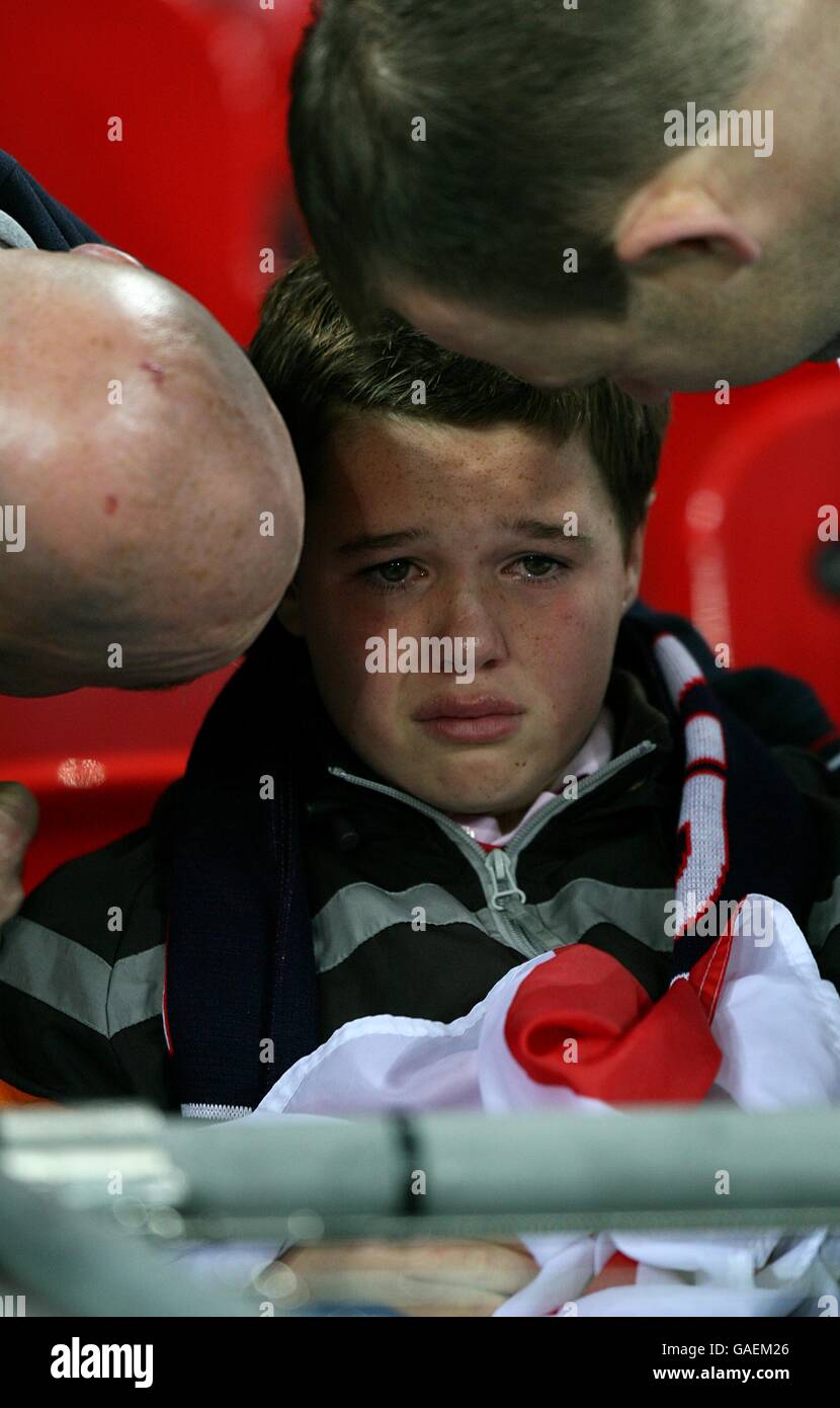 A Young England fans in tears after his side failed to qualify for the ...