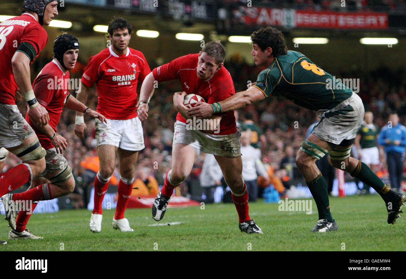 Wales' Rhys Thomas steps inside South Africa's Ryan Kankowski during ...