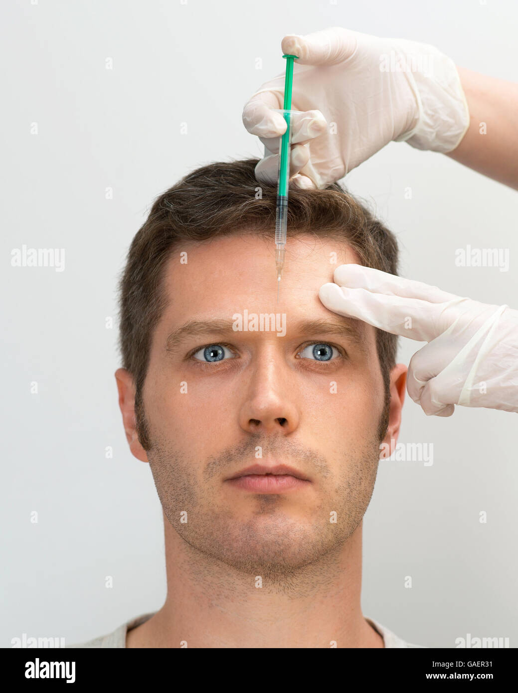 Handsome man is getting injection. Concept of aesthetic beauty. Place ...