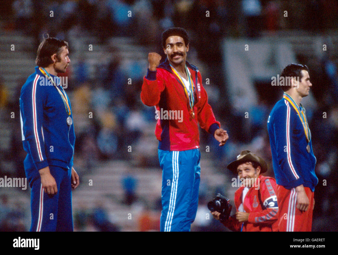 Great Britain's Daley Thompson (c) gives a celebratory clenched fist ...