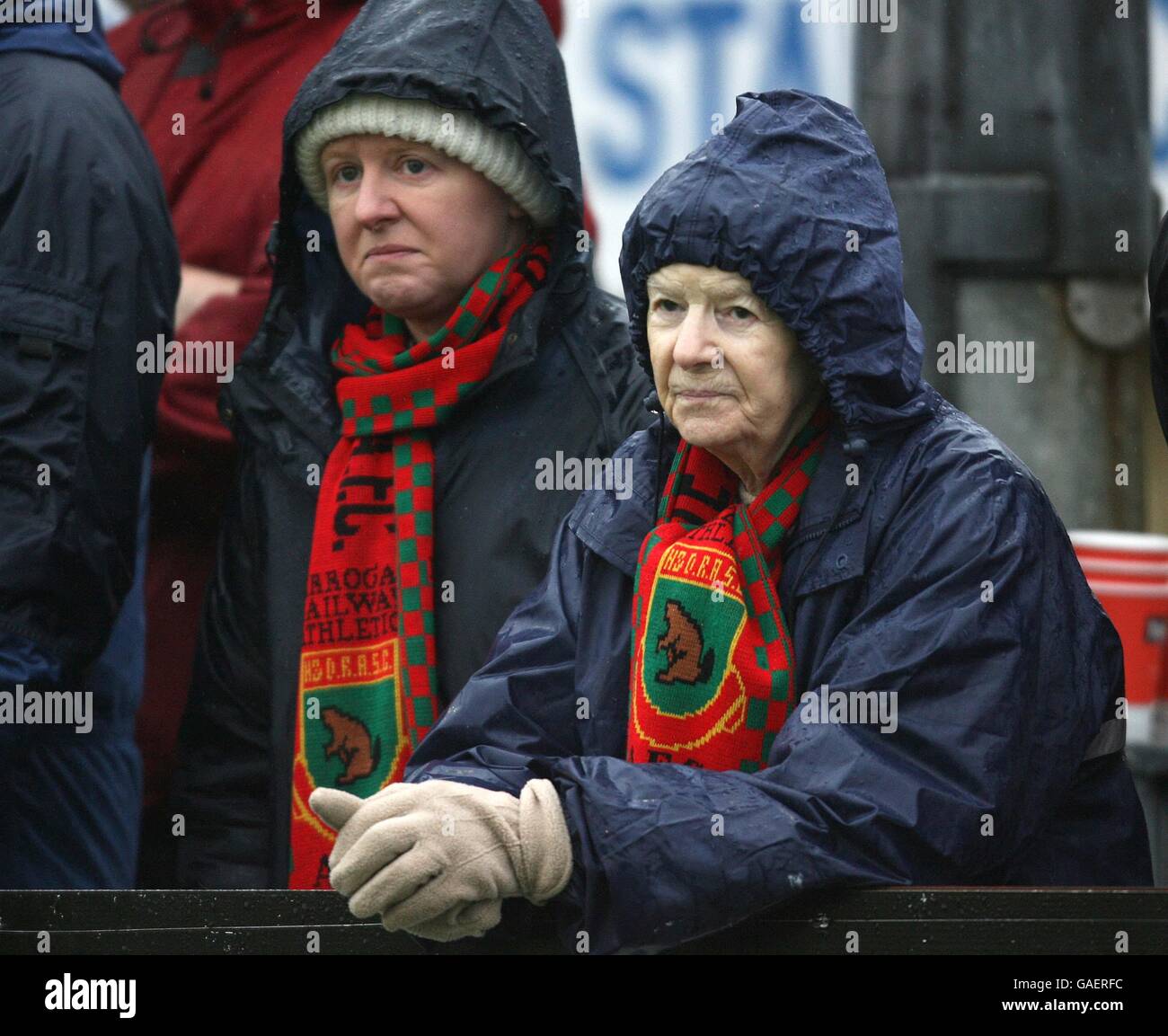 A couple of unhappy looking Harrogate Railway fans during the game ...