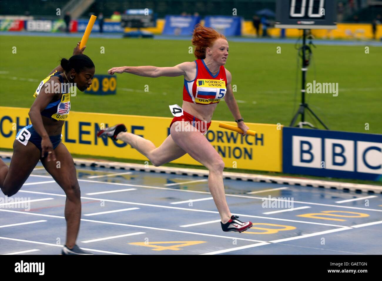 Russia's Marina Kislova (r) stretches for the line with USA's Chryste ...