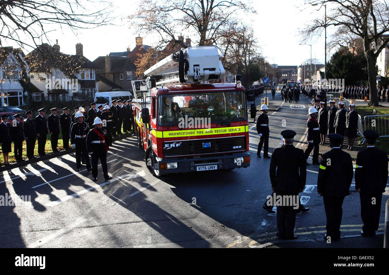 The fire appliance carrying the coffin of Ian Reid arrives at St ...