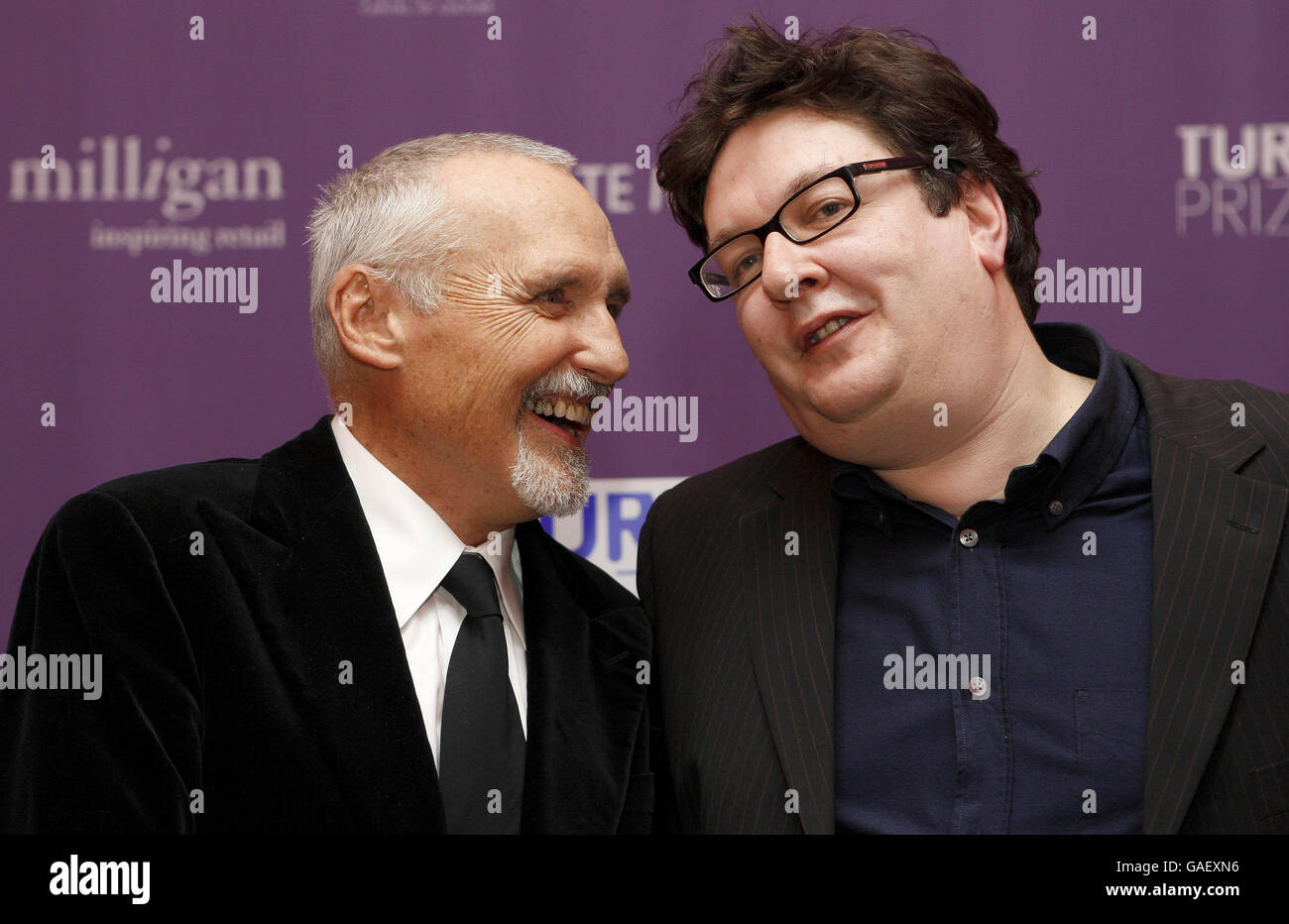 Actor Dennis Hopper (left) laughs with artist Mark Wallinger after he ...