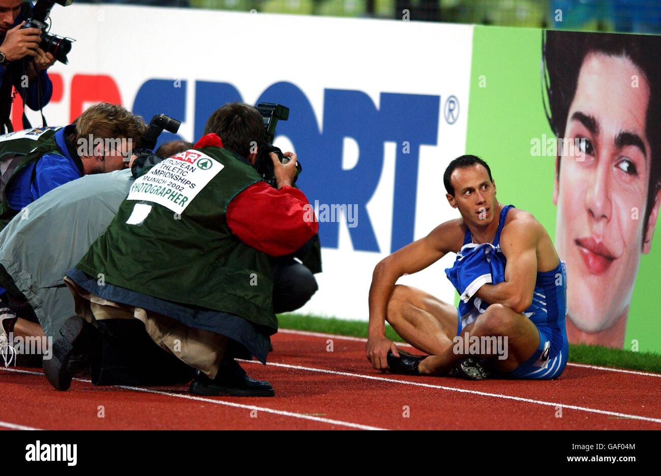 Greece's Konstantinos Kenteris takes time out from celebrating his win ...