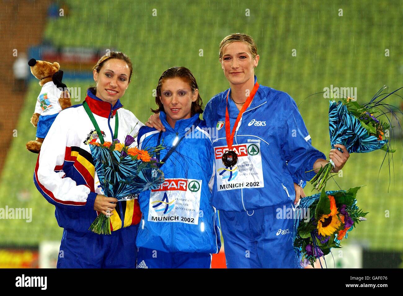 Greece's 100m gold medalist Ekaterini Thanou is joined on the podium by ...