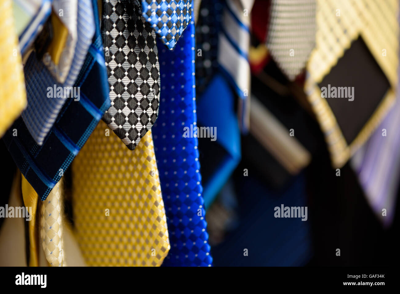 A bunch of ties hanging in a closet Stock Photo - Alamy