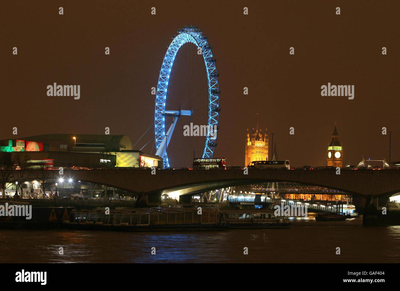 A view by night of Waterloo Bridge crossing the River Thames with a ...