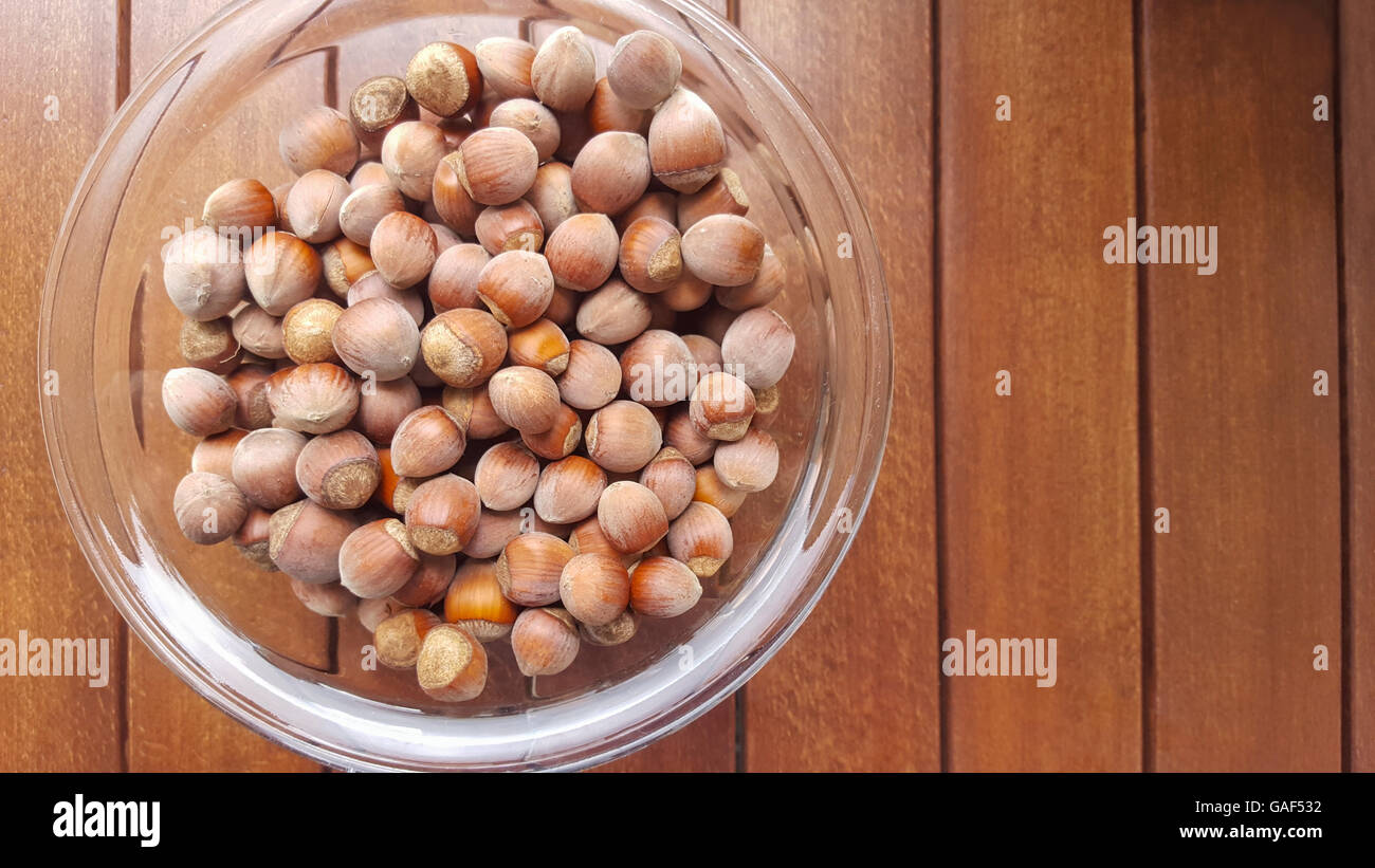 A bunch of hazelnuts in glass dish Stock Photo - Alamy