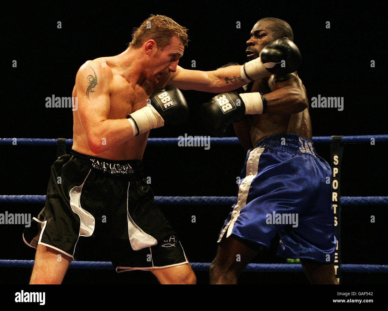 Scotland's Kenny Anderson (left) in action against England's Simeon ...
