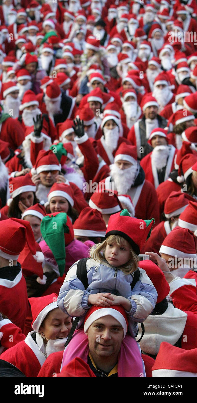 Thousands of people, dressed up as Santa, take part in The Great ...