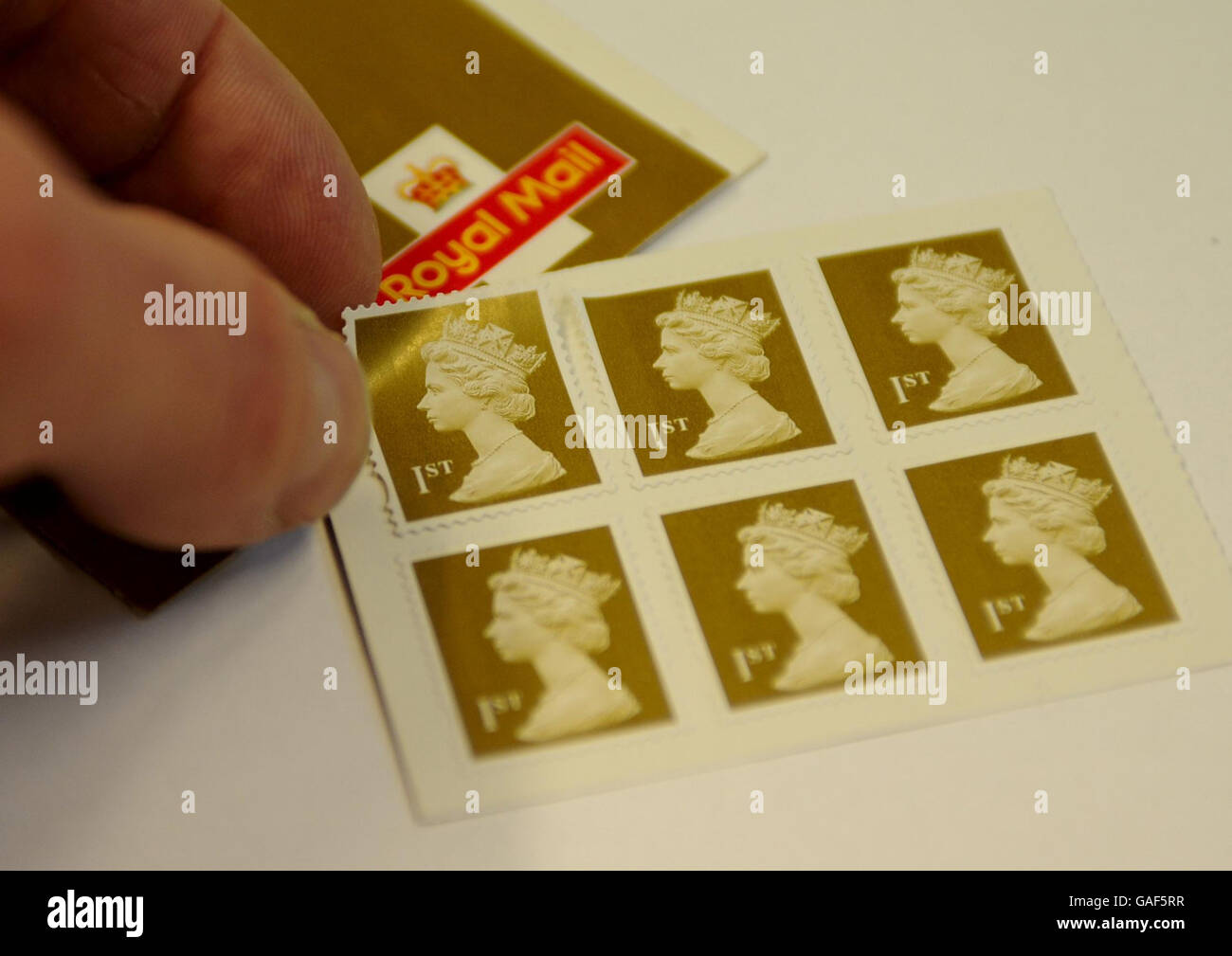 A book of first class stamps hi-res stock photography and images - Alamy