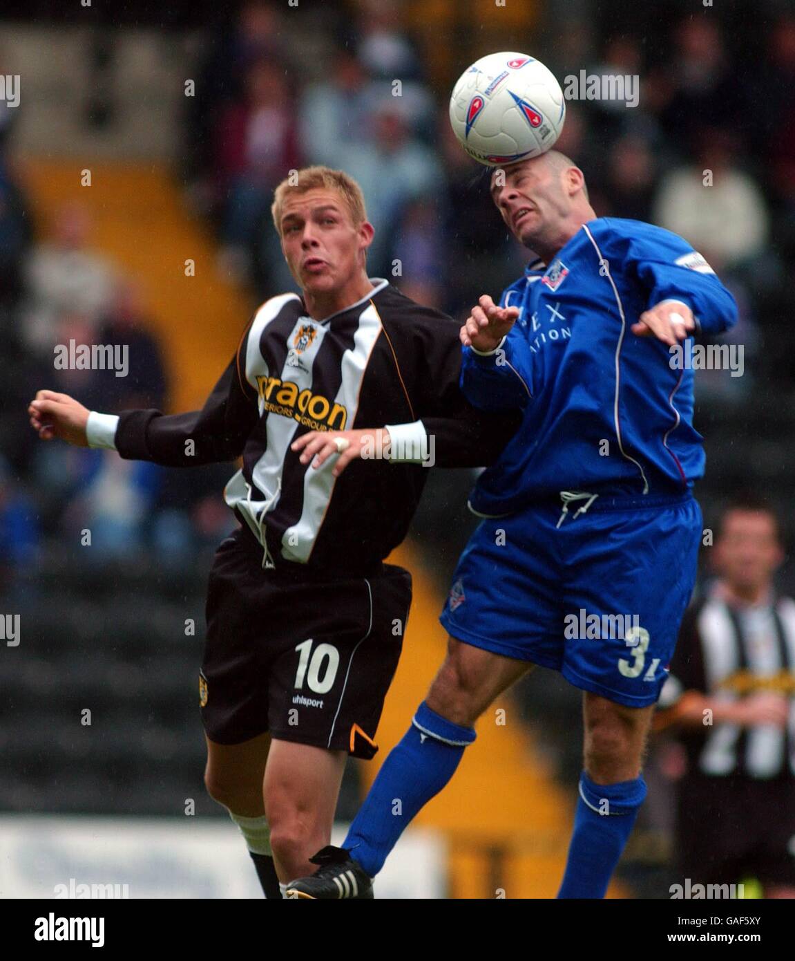 Notts County's Danny Allsopp (l) and Oldham's Darren Sheridan battle ...