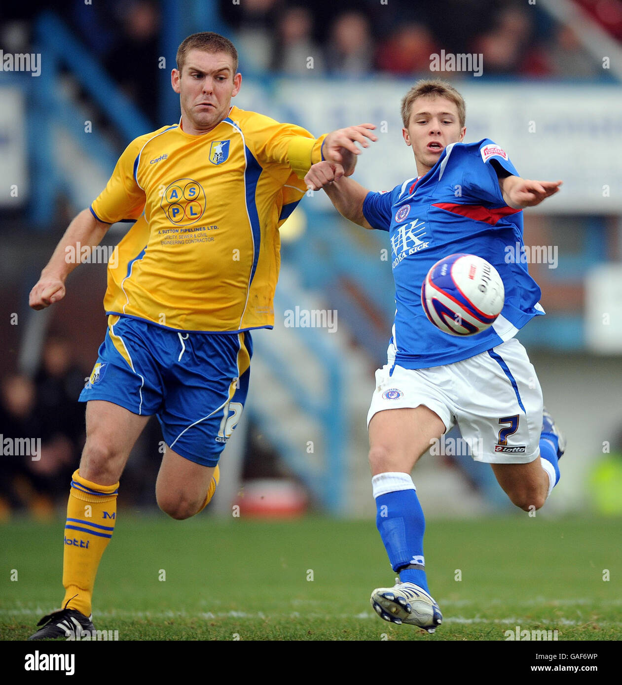 Chesterfield's Jamie Ward and Mansfield Town's Jake Buxton in action ...
