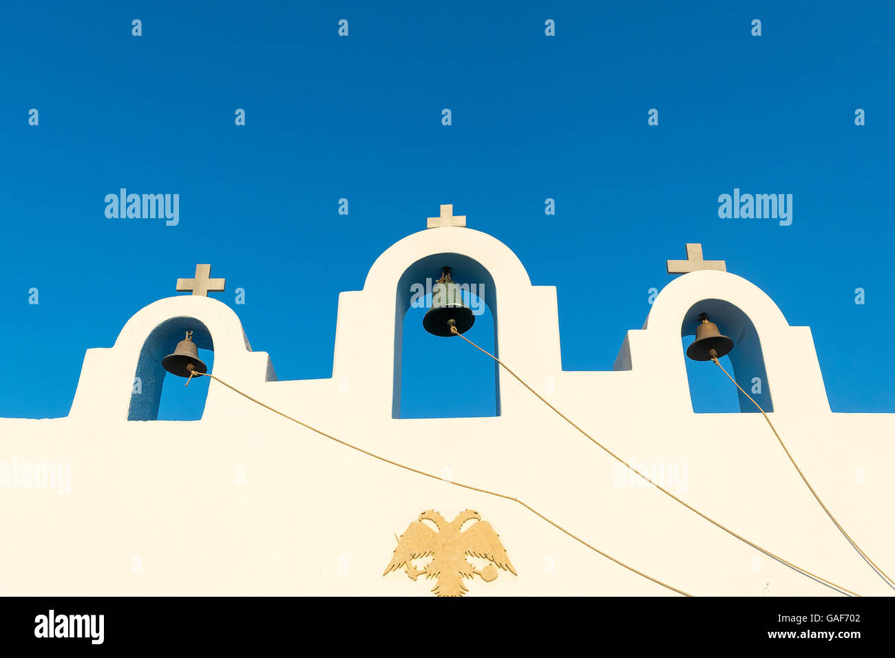 Three Bells against the blue sky in Paros island in Greece Stock Photo ...