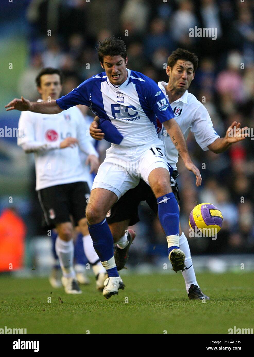 (L-R) Franck Queudrue, Birmingham City and Clint Dempsey, Fulham battle ...