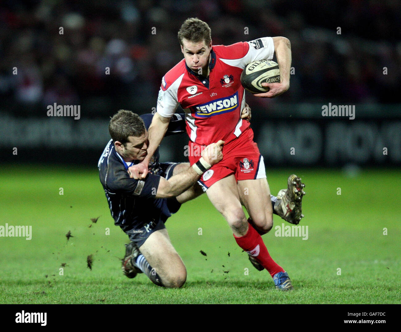 Gloucester's Chris Paterson is tackled by Rob Higgitt of Bristol during ...