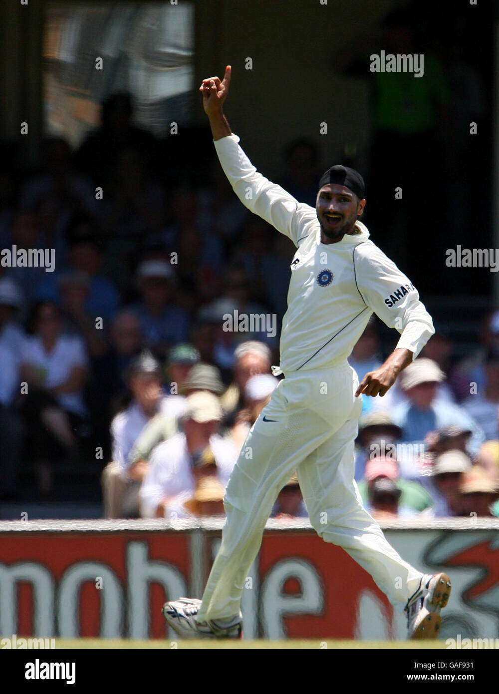 India's Harbhajan Singh celebrates claiming the wicket of Australia's ...