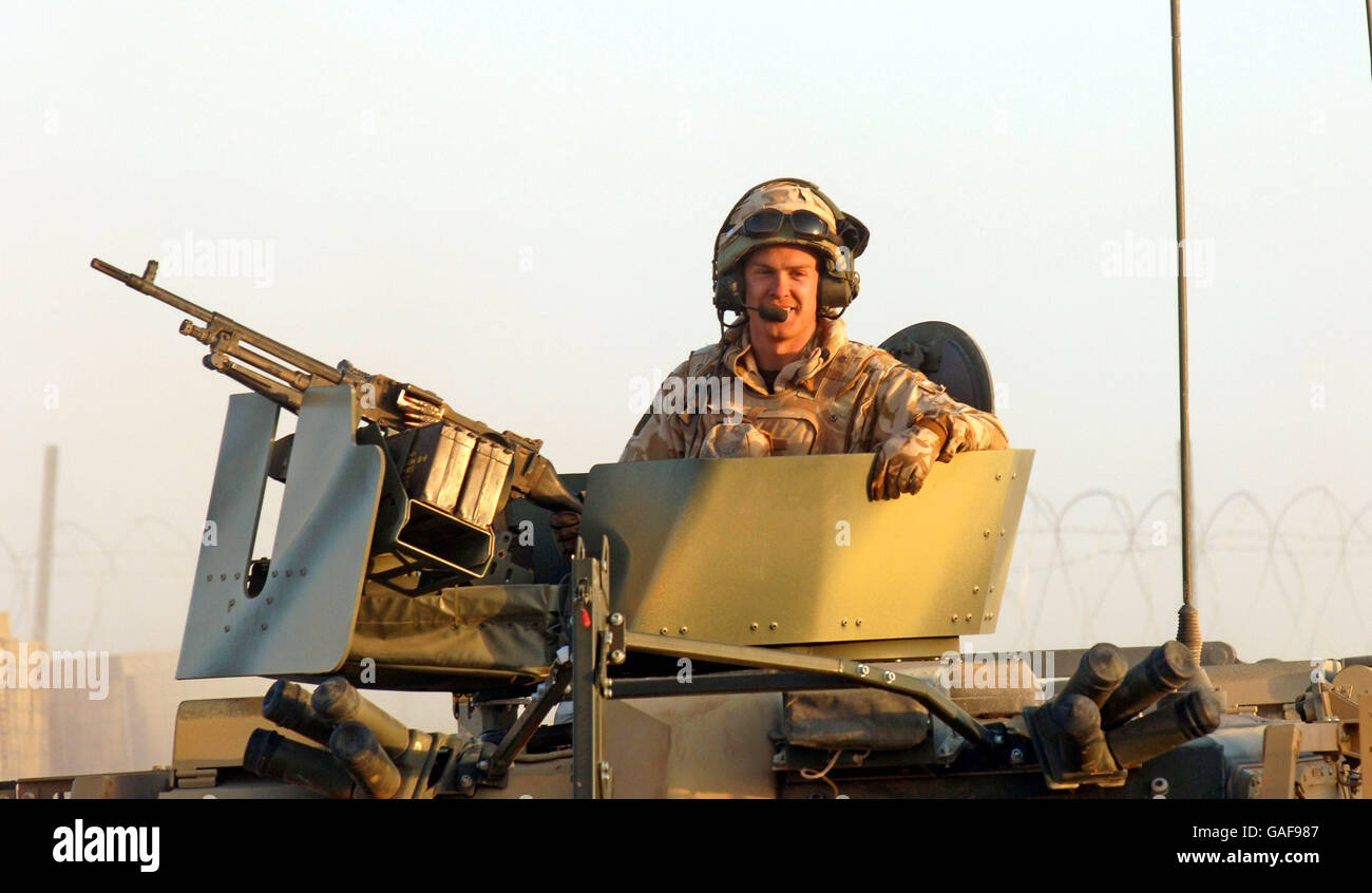 A Royal Marine Commando sits in the gun Turret of a Viking Armoured ...
