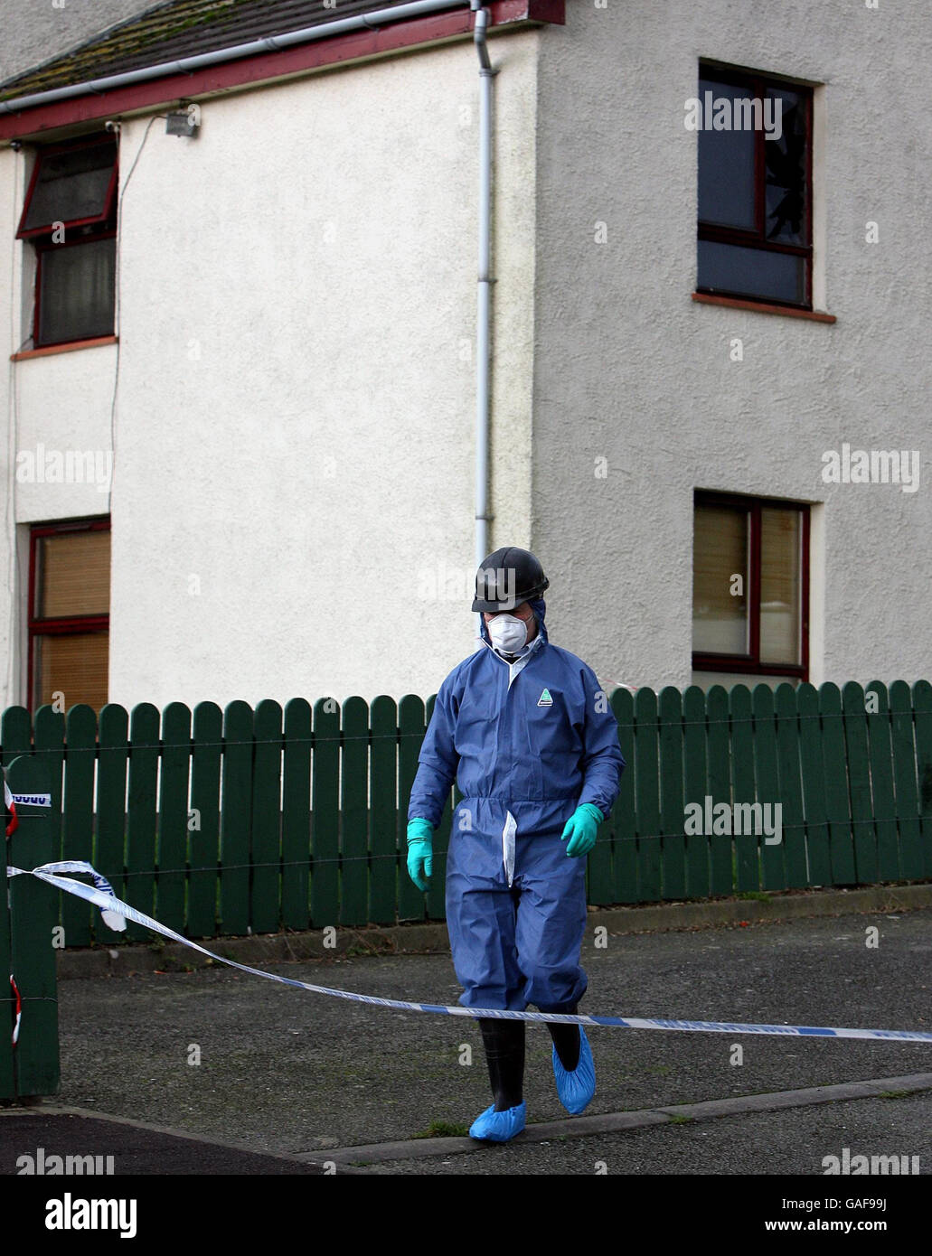 Police Forensic experts at a flat in Downpatrick Co Down following a ...